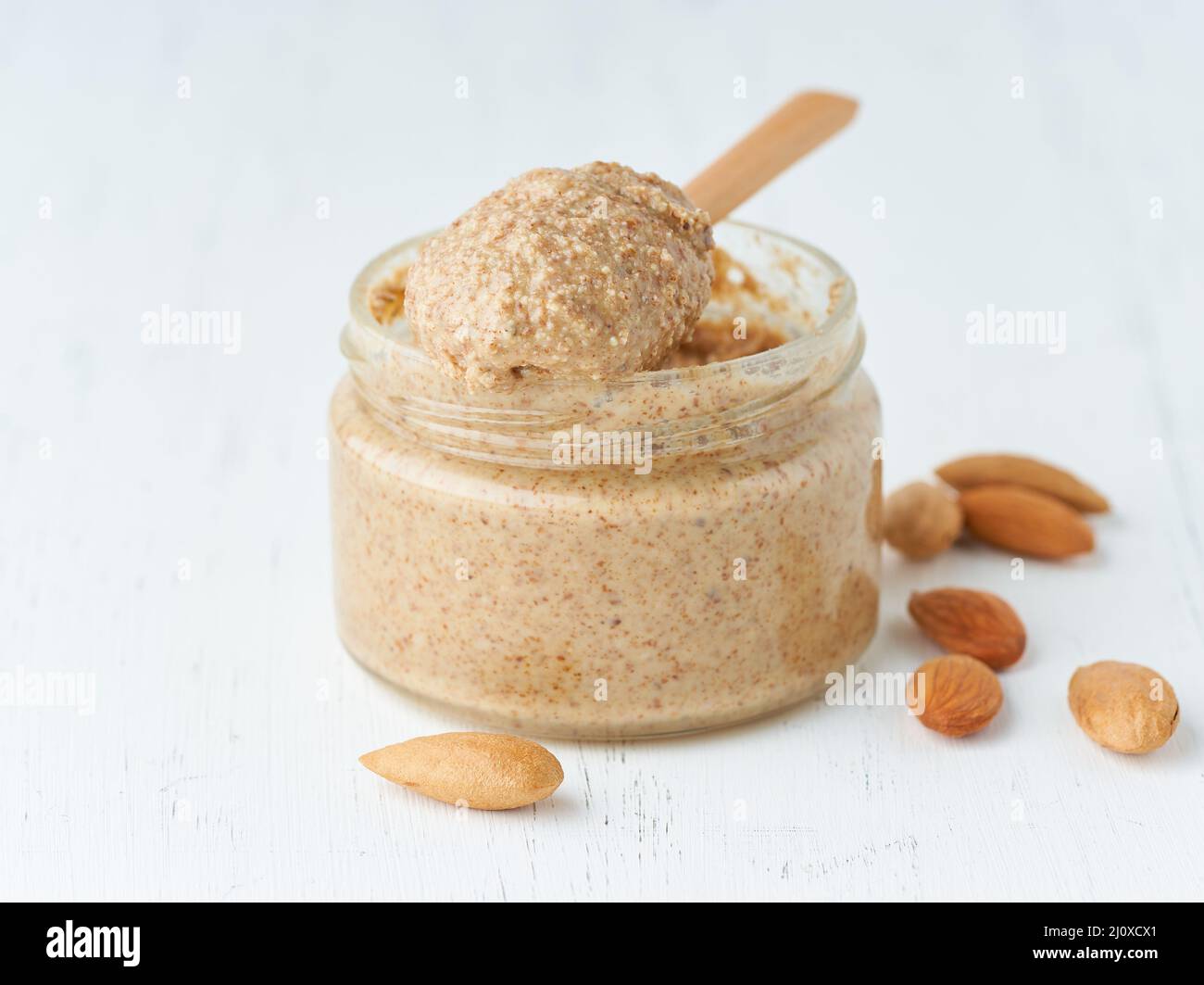 Almond butter, raw food paste made from grinding almonds into nut ...