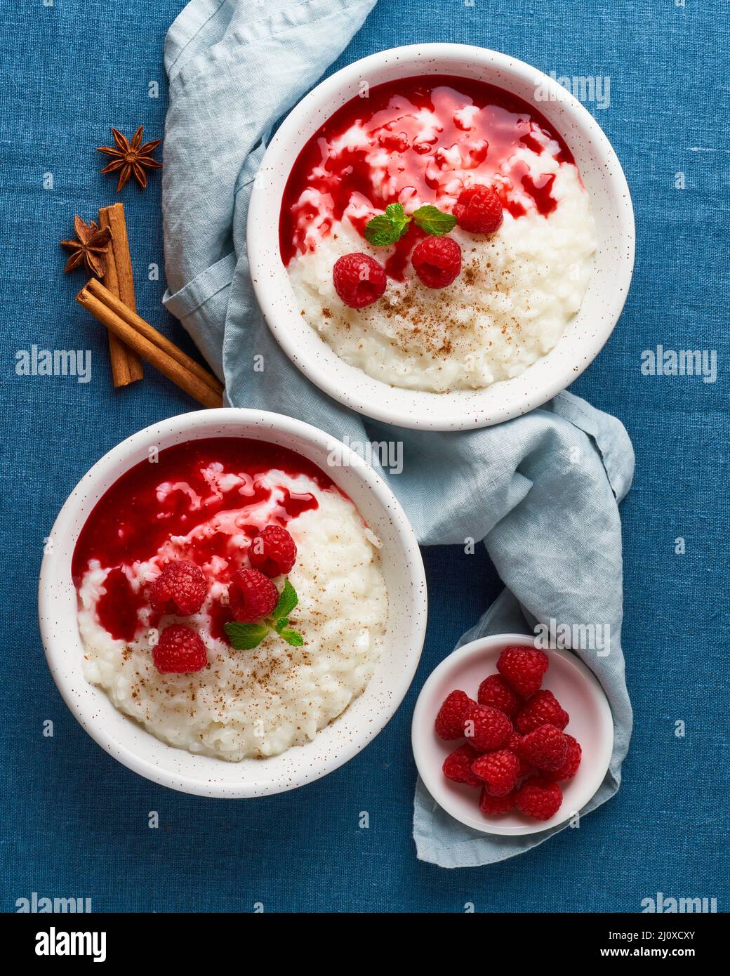 Rice pudding. French milk rice dessert with raspberries, blueberries ...