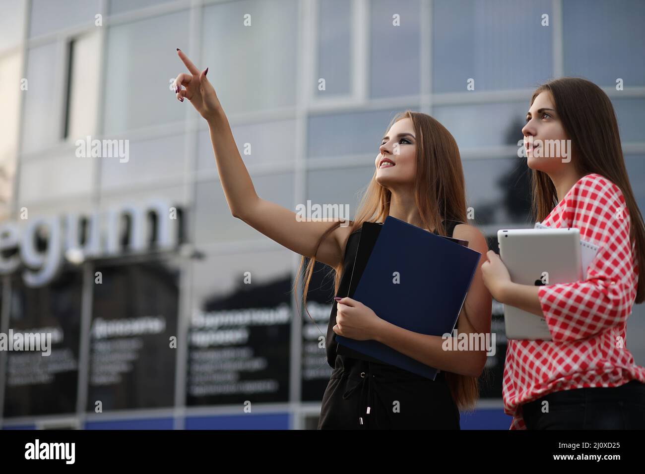 Girl with documents at a business meeting near a modern building Stock ...