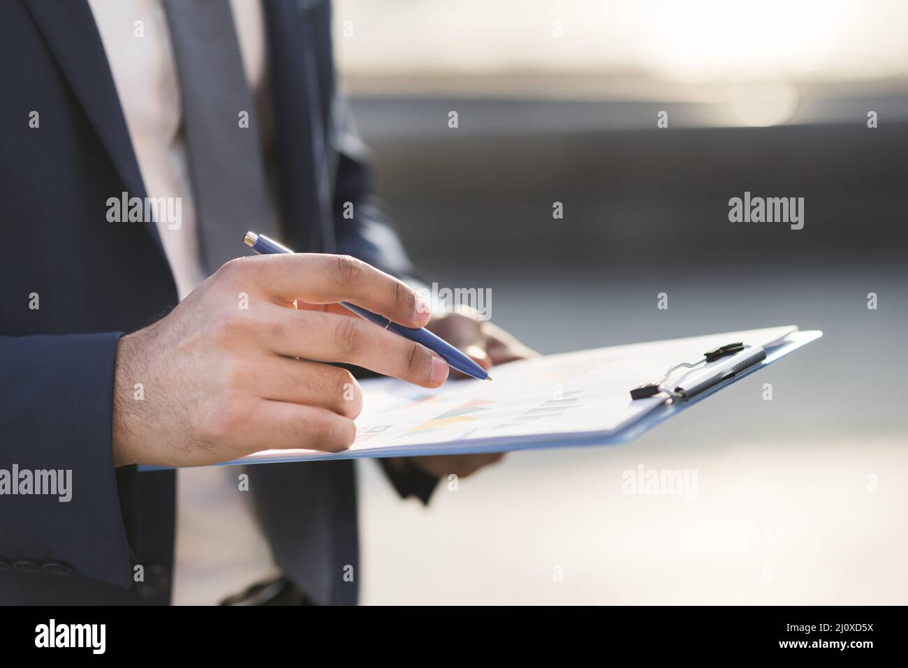Close up business man checking clipboard. High quality beautiful photo ...