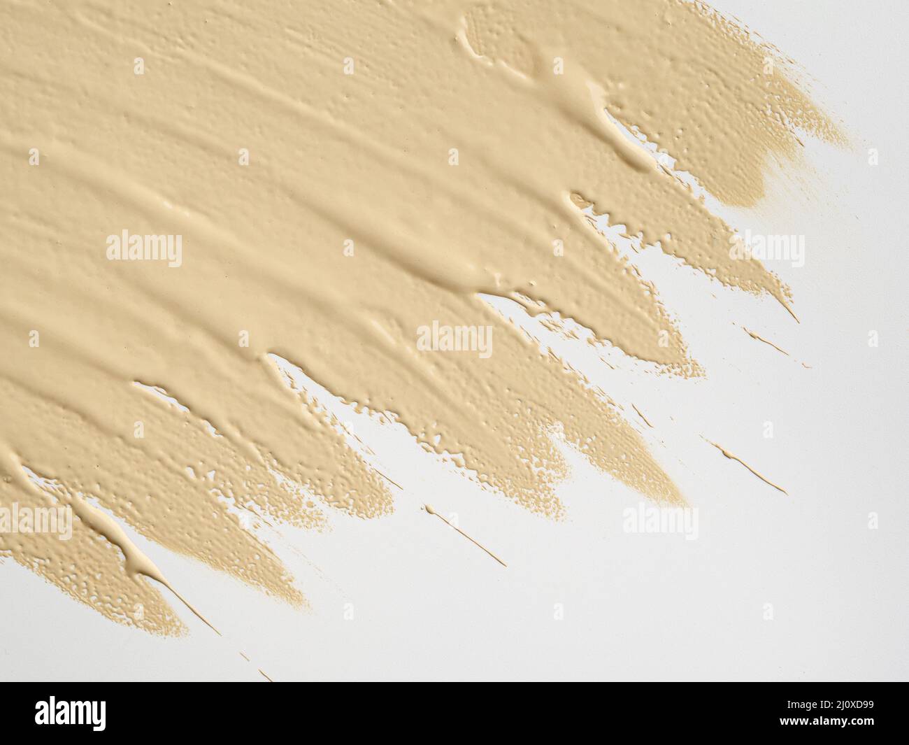 Abstract foundation stain white background Stock Photo - Alamy