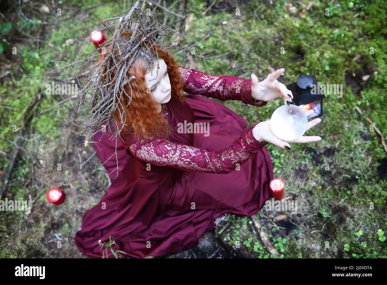Witch holds a ritual in the depths of the forest Stock Photo - Alamy