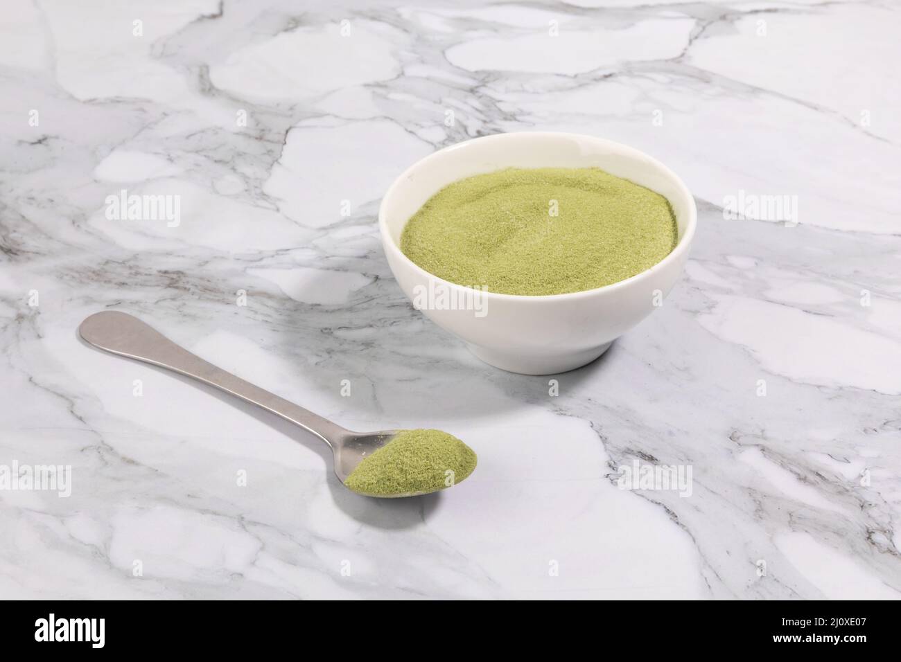 matcha green tea powder powder in a white bowl Stock Photo - Alamy