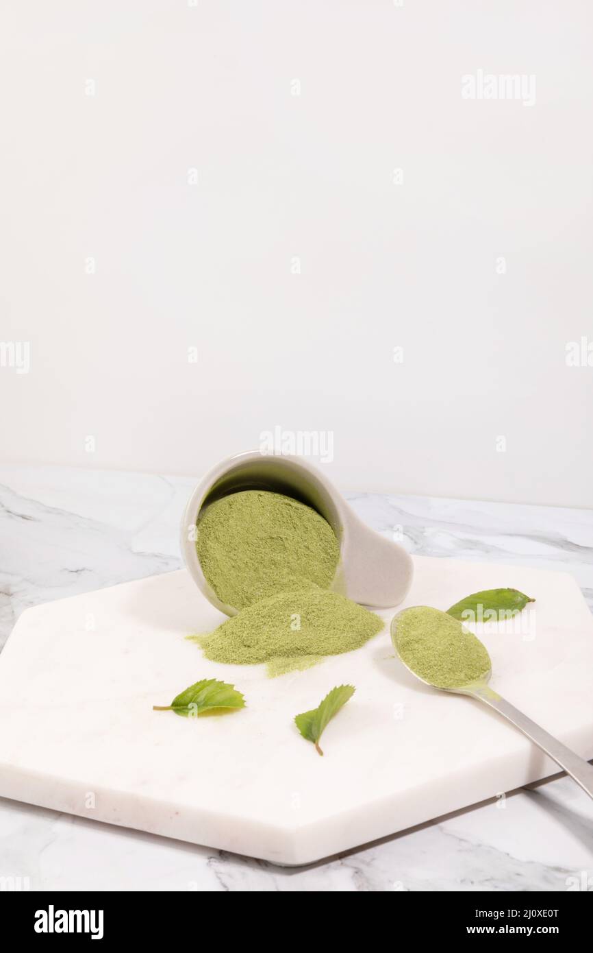matcha green tea powder powder in a white bowl Stock Photo - Alamy