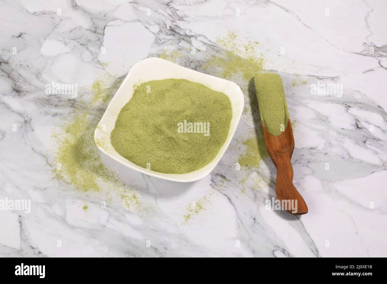 matcha green tea powder powder in a white bowl Stock Photo - Alamy
