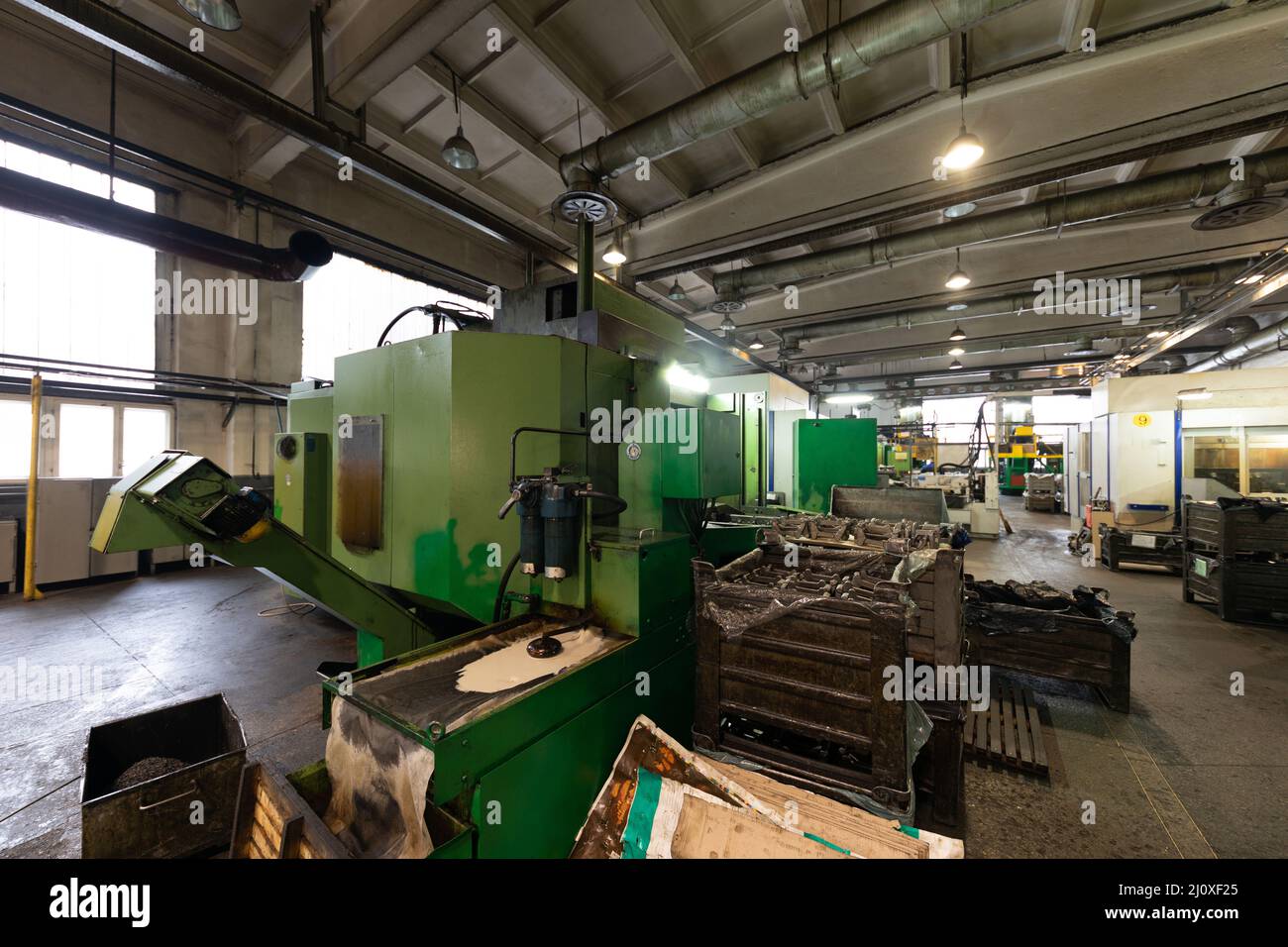 The interior of a big industrial building of factory with steel ...
