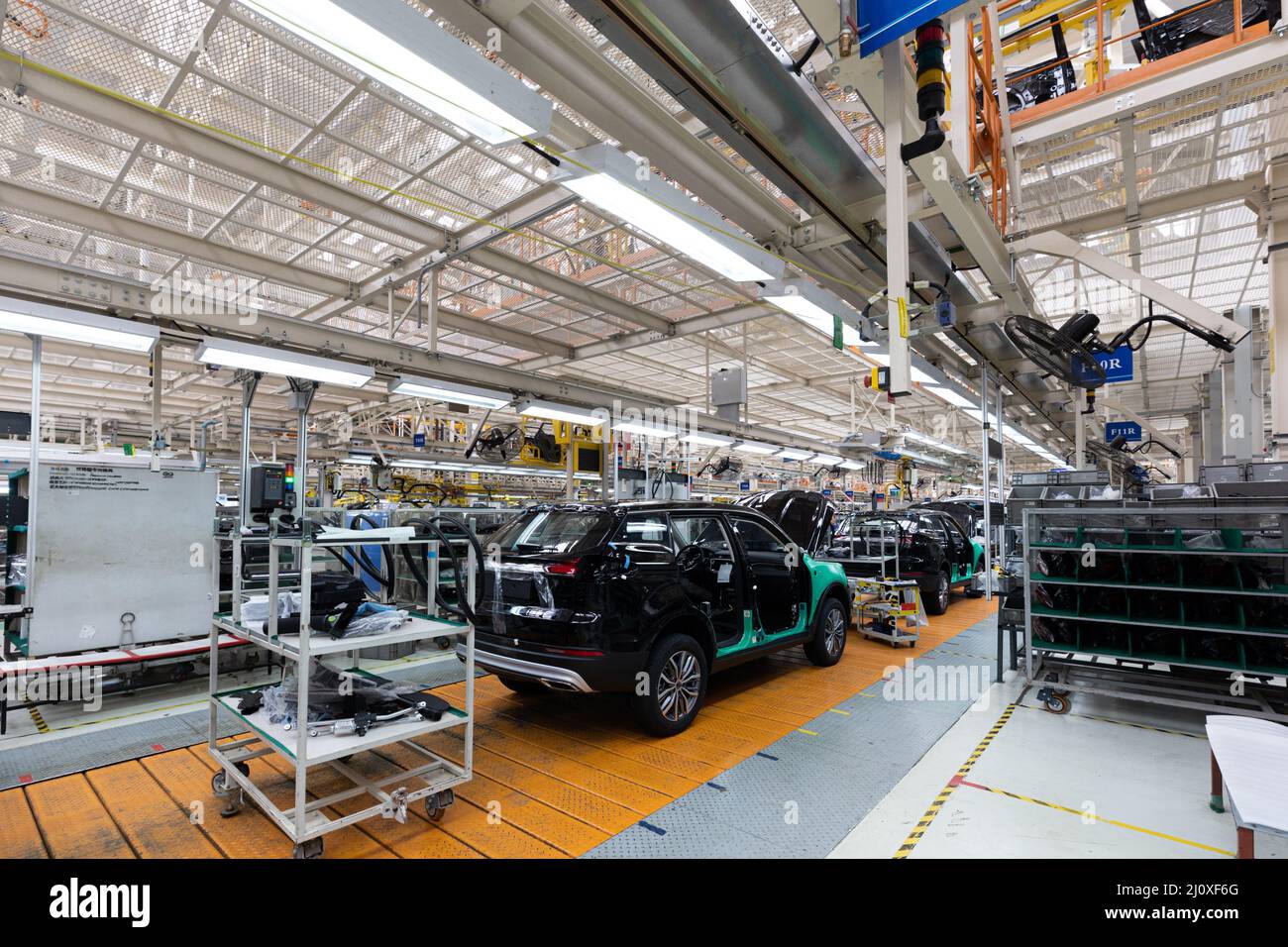 Car bodies are on assembly line. Factory for production of cars. Modern ...