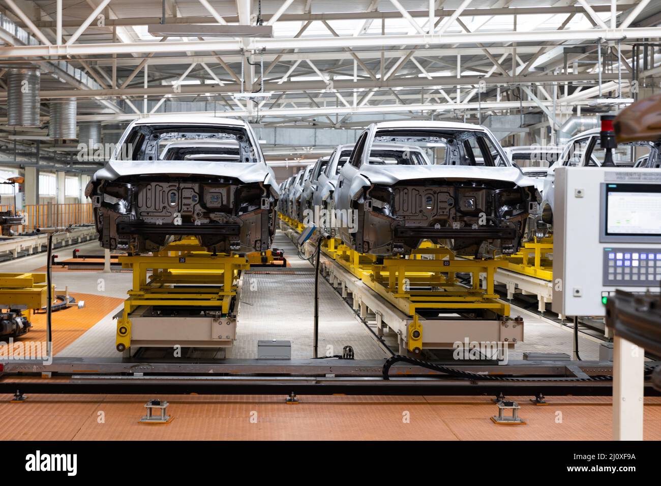 Photo of automobile production line. Welding car body. Modern car ...