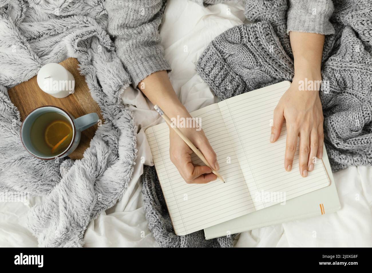 Woman writing notebook table hi-res stock photography and images - Alamy