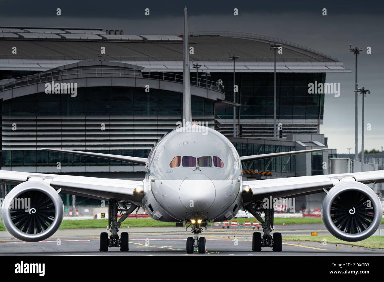 Front view of an airplane at an airport Stock Photo - Alamy