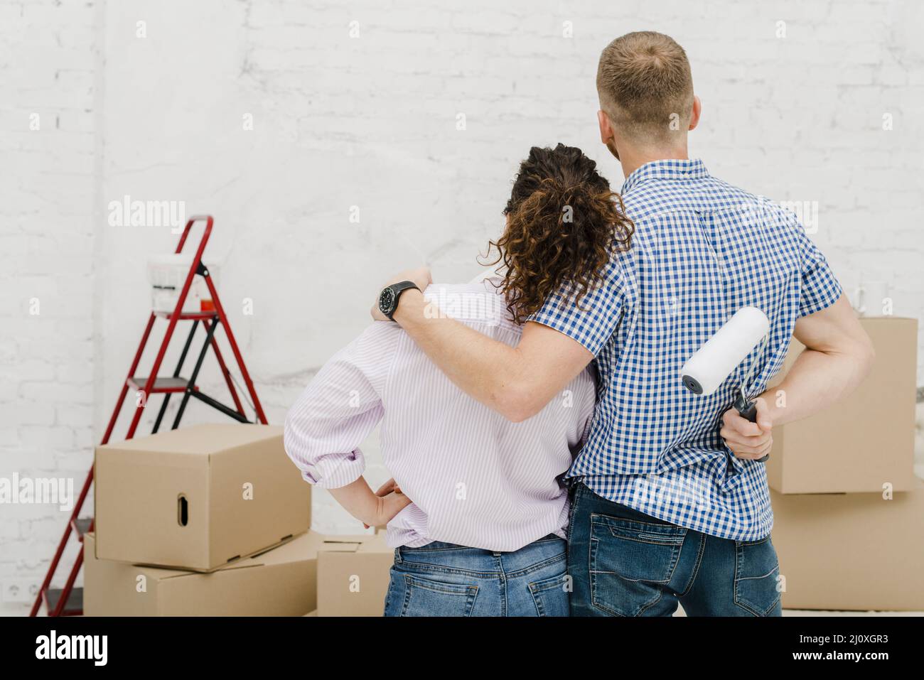 Hugging wall hi-res stock photography and images - Alamy