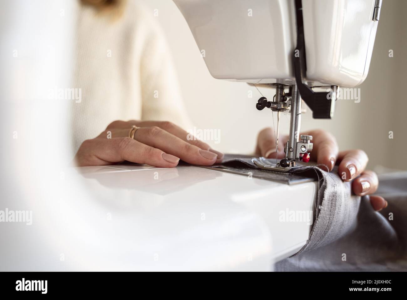 Close up person using sewing machine. High quality beautiful photo ...