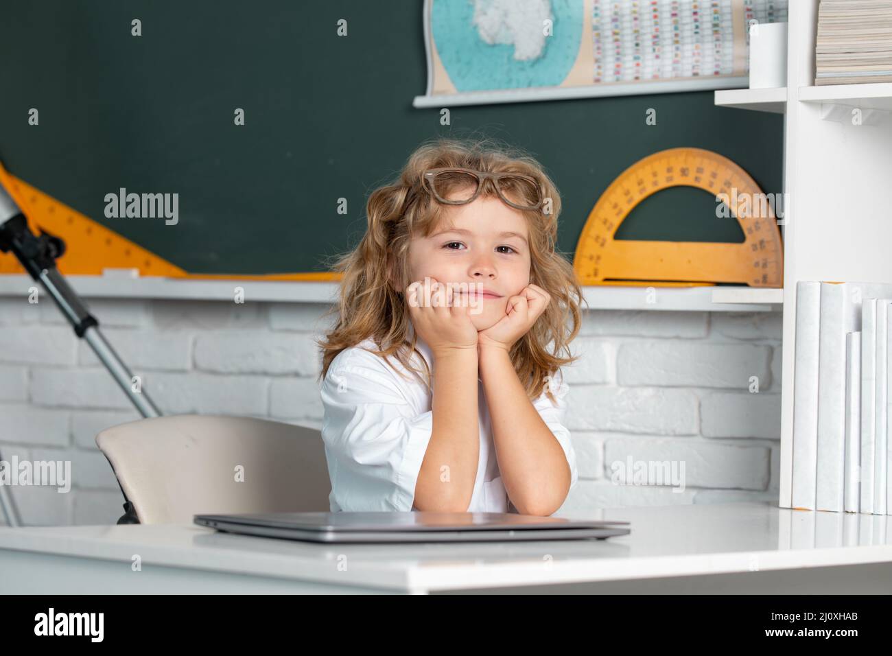 Smart cute boy thinking math hi-res stock photography and images - Alamy