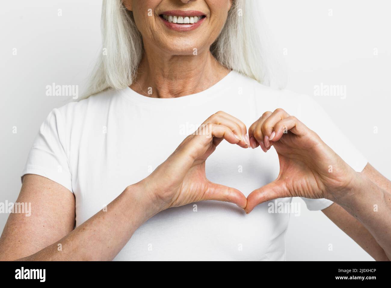 Smiley woman showing heart with hands. High quality beautiful photo ...