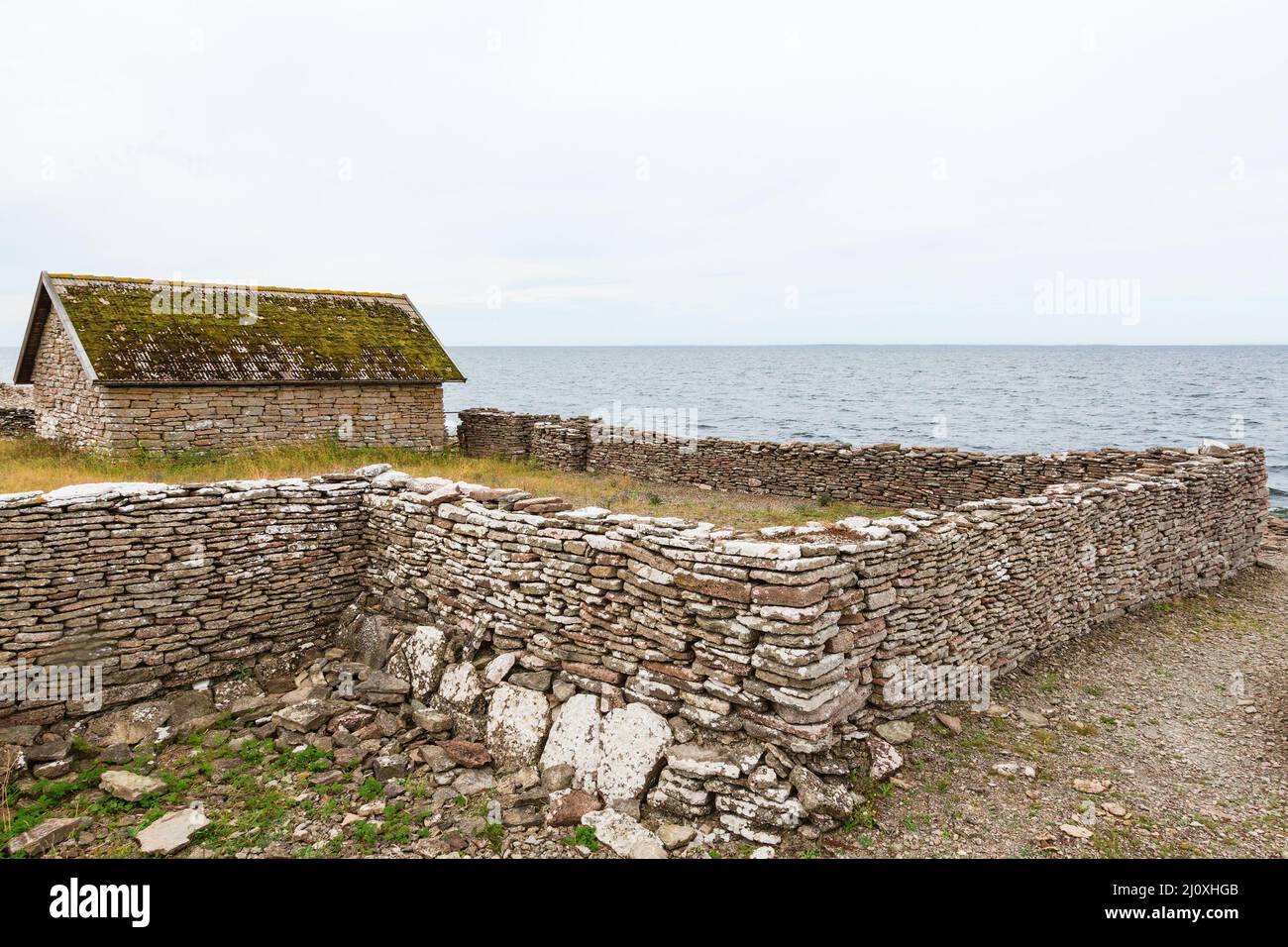 Old boathouse with stone wall on the shore Stock Photo - Alamy