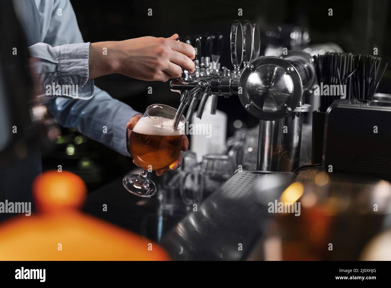 Close up hand pouring beer glass. High quality beautiful photo concept Stock Photo - Alamy