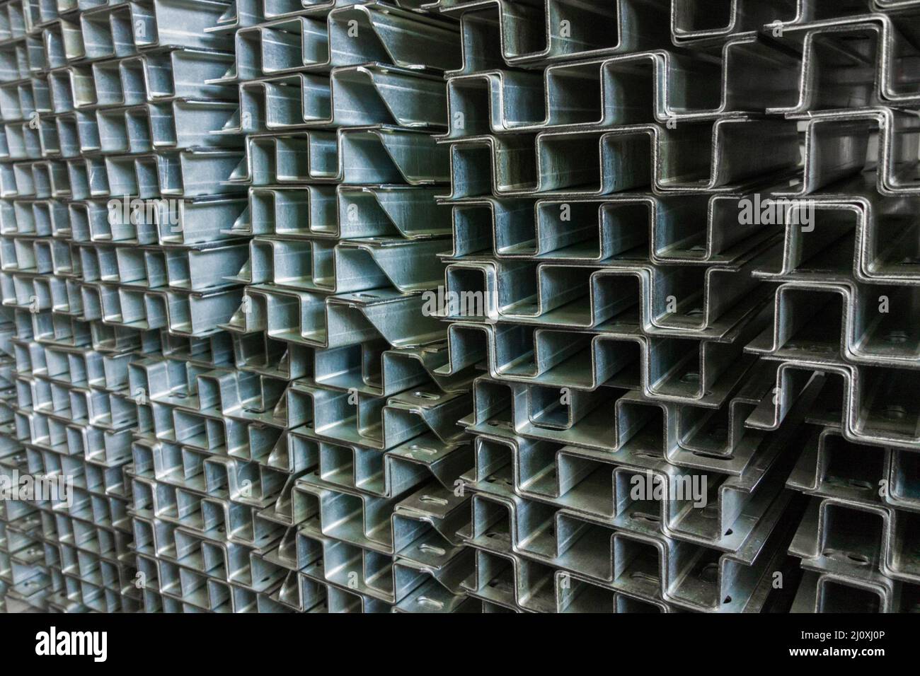 full frame view on stack of profile bent sheet metal parts Stock Photo ...