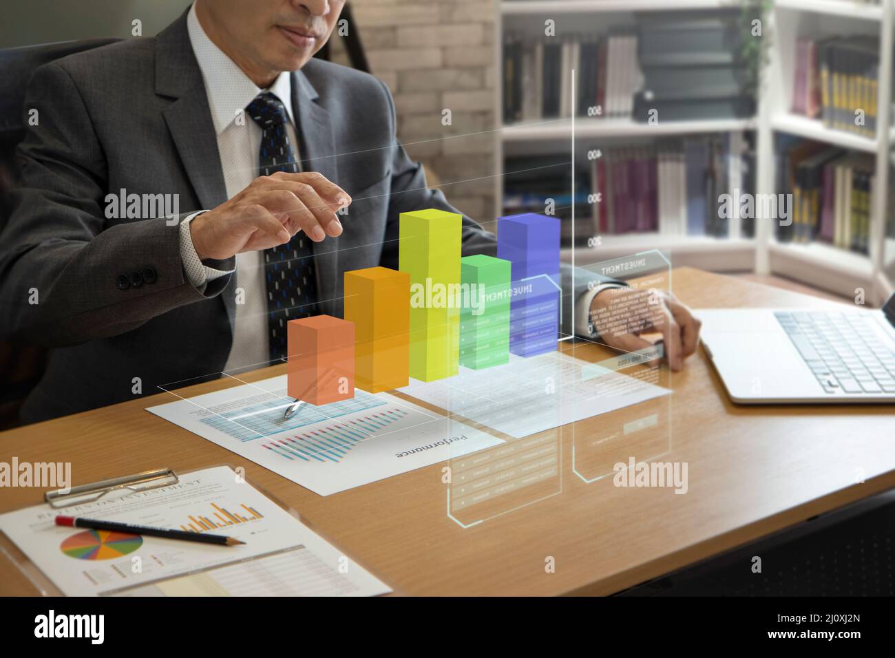 Asian businessman interacting with augmented reality three-dimensional ...