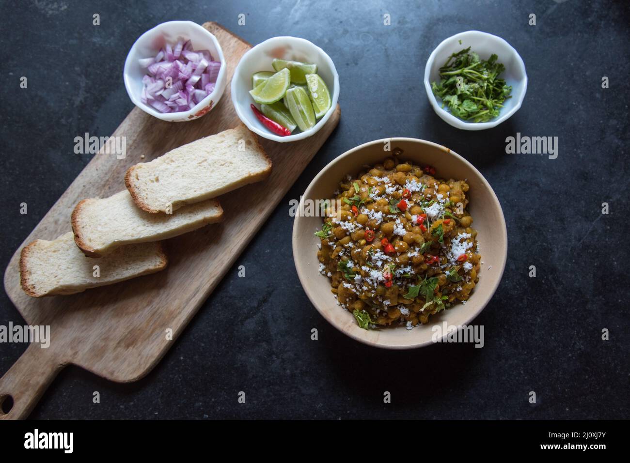 Indian street food ghugni or dried yellow peas cooked with spices ...
