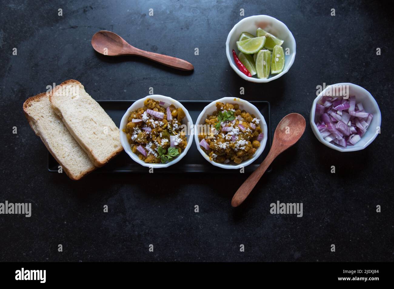 Indian street food ghugni or dried yellow peas cooked with spices ...