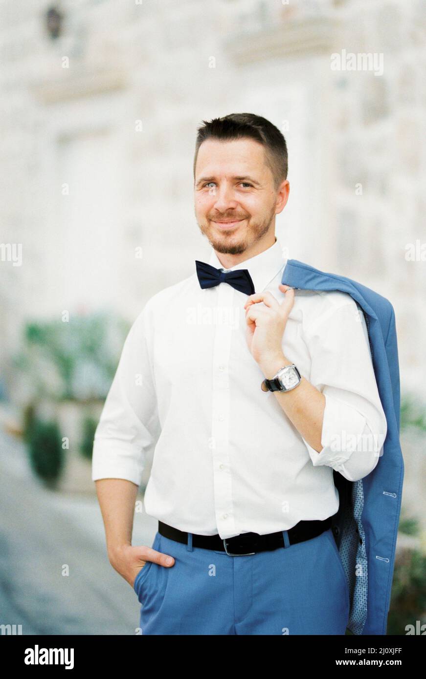 Hand holding man by jacket hi-res stock photography and images - Alamy