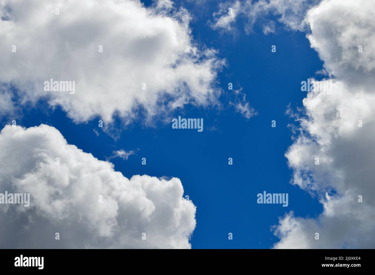 Cumulus clouds forming in blue hi-res stock photography and images - Alamy