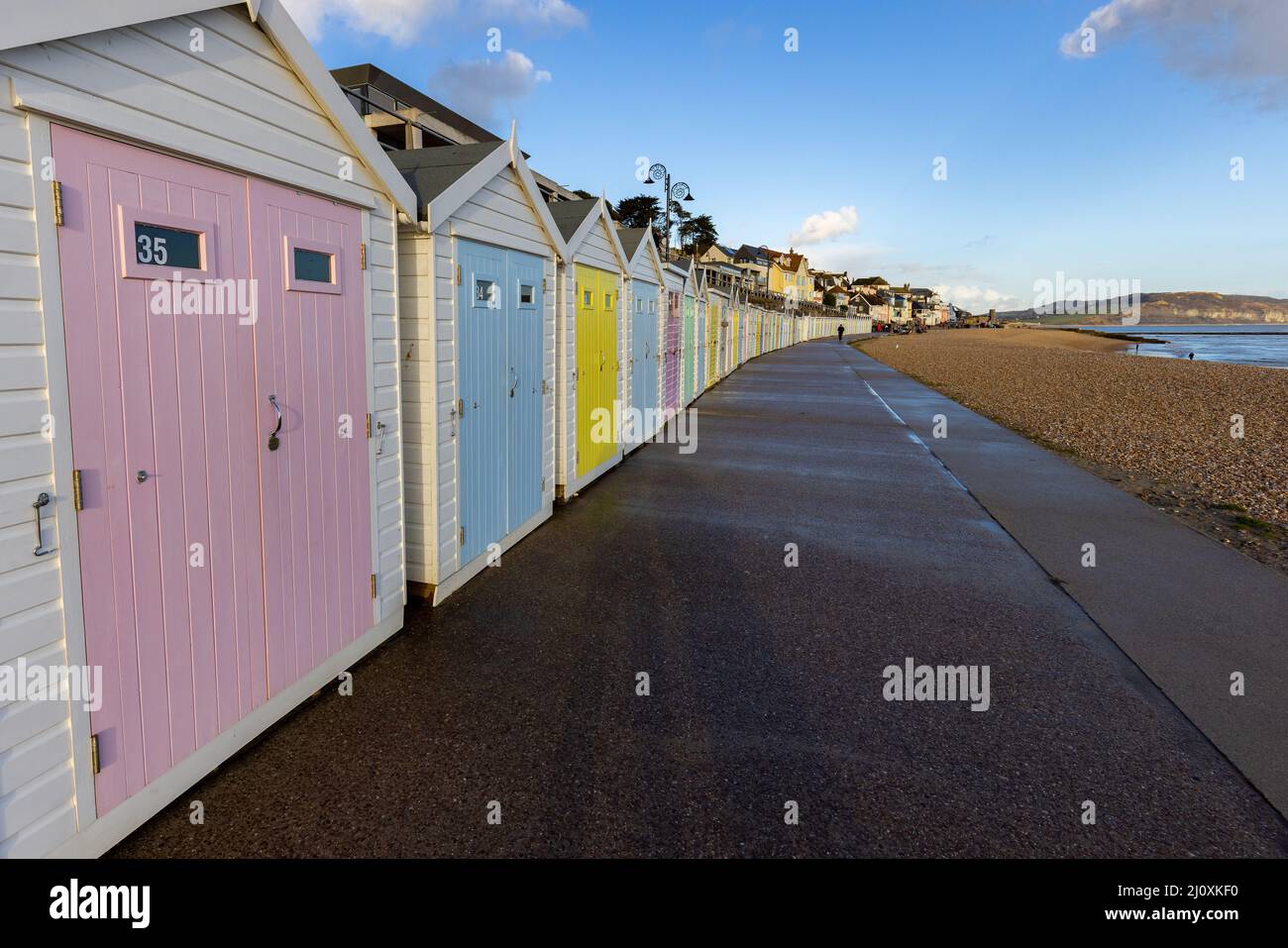 Coloured beachuts on seafront at Lyme Regis, Dorset, UK Stock Photo - Alamy