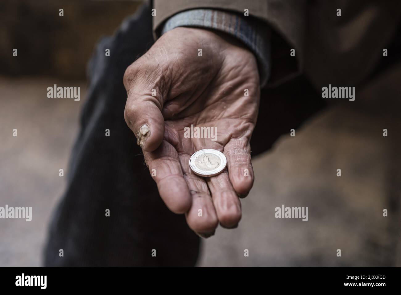 Homeless man holding coin his hand. High quality beautiful photo ...