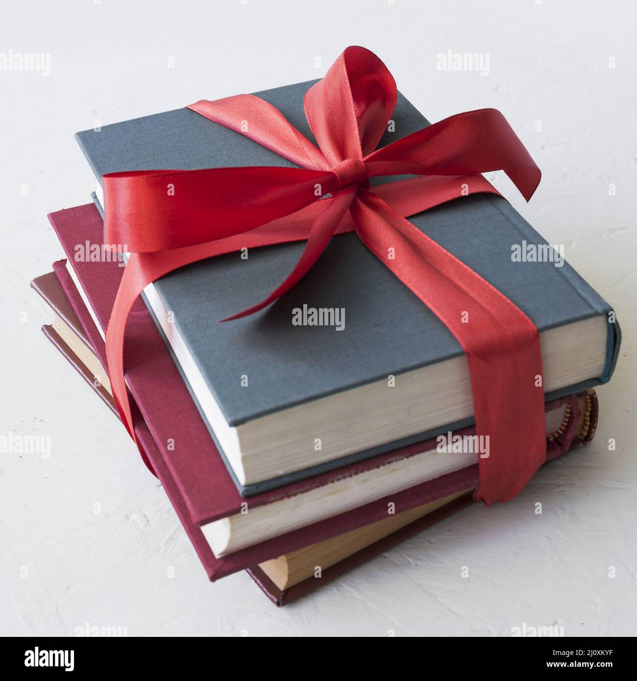 Books with red ribbon. High quality beautiful photo concept Stock Photo ...