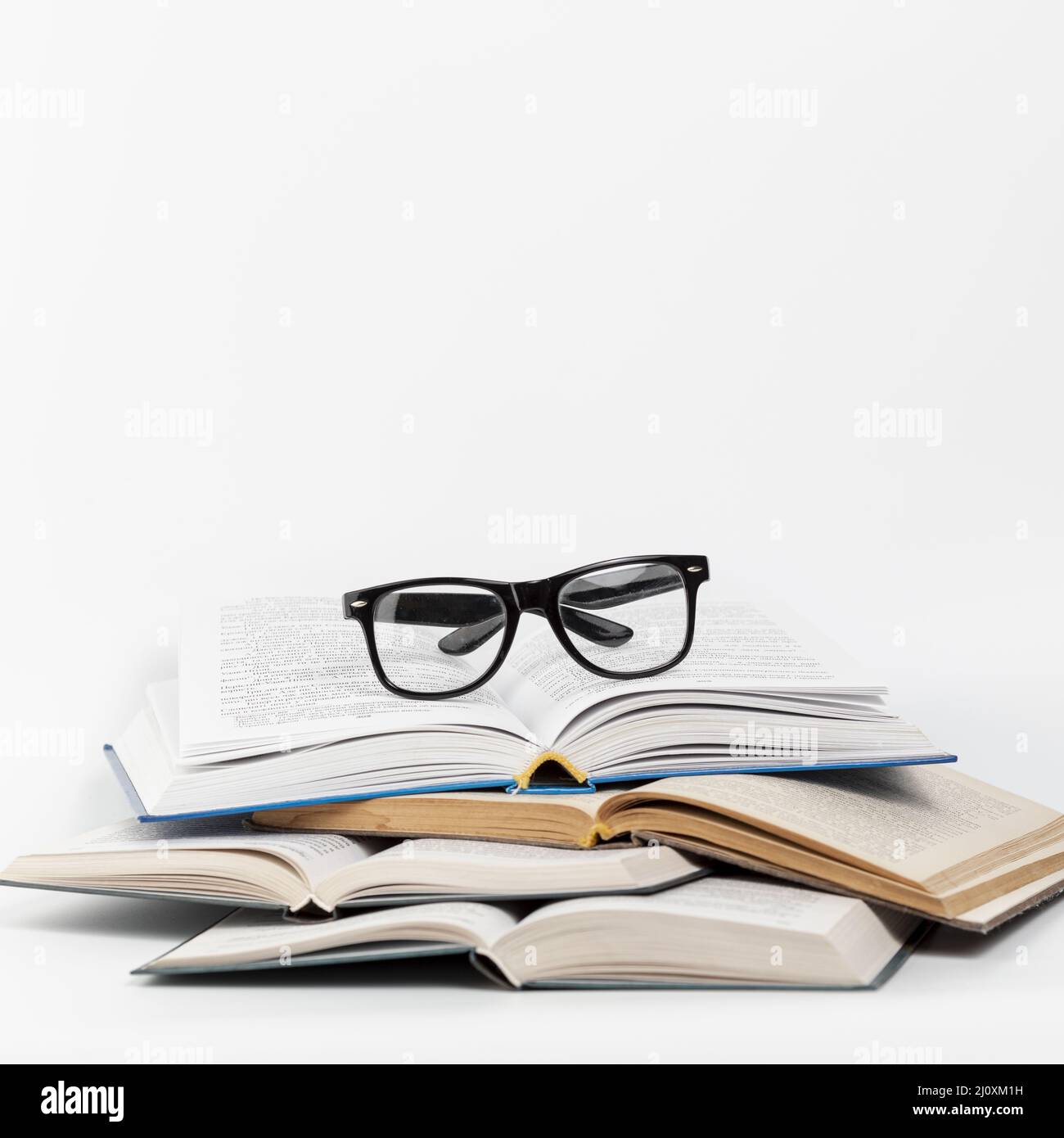 Front view open books with glasses. High quality beautiful photo ...