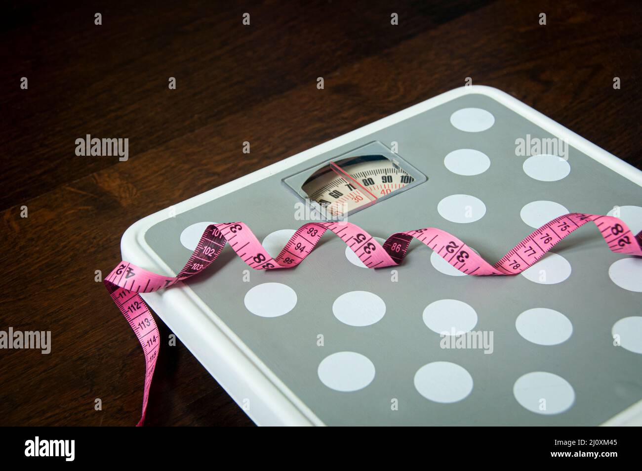 Side view of weight scale and measuring tape. Weight loss and fitness ...