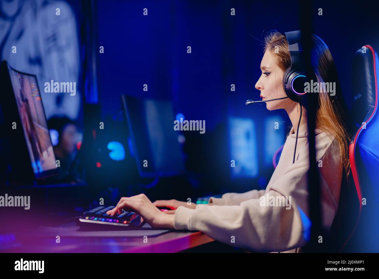 Young woman streamer play on online video game tournament, neon color ...