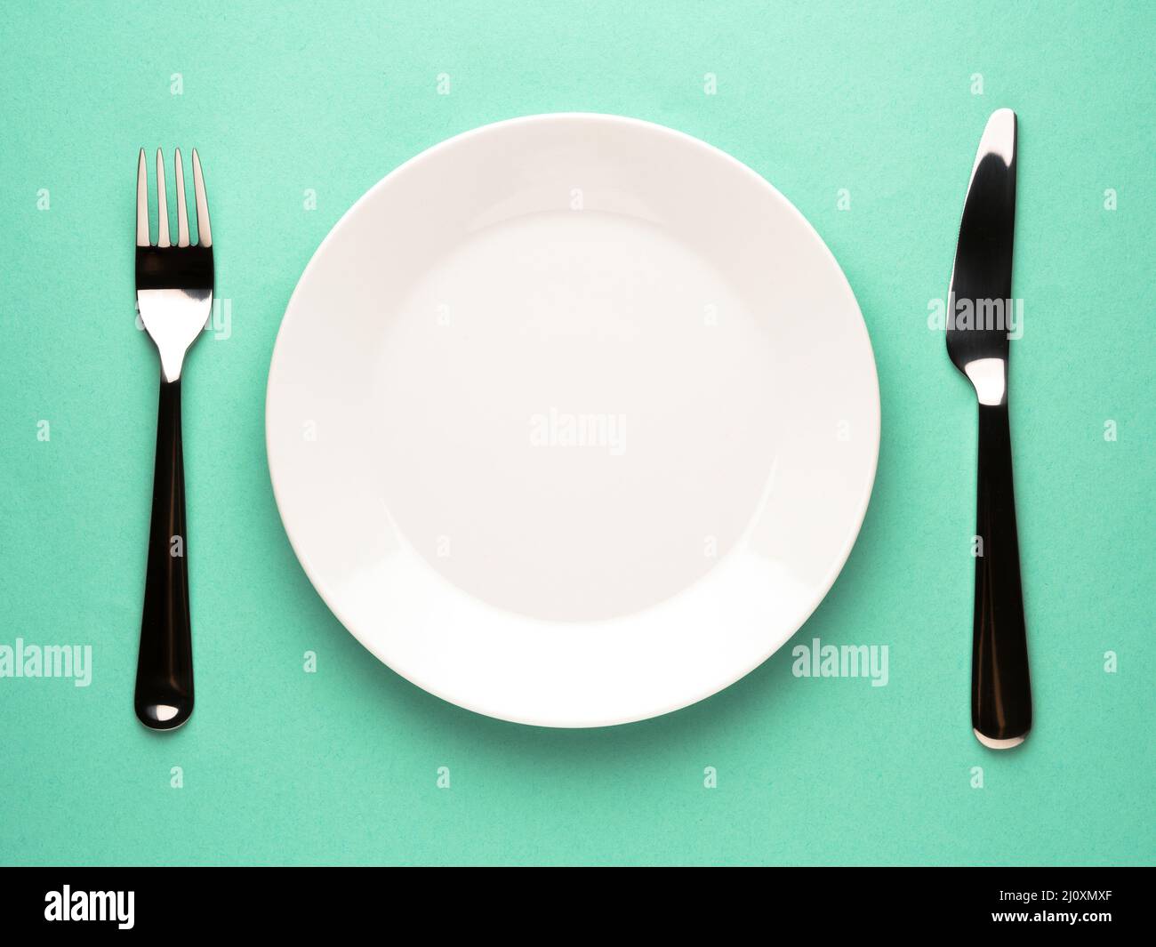 Knife fork plate blue background hi-res stock photography and images ...