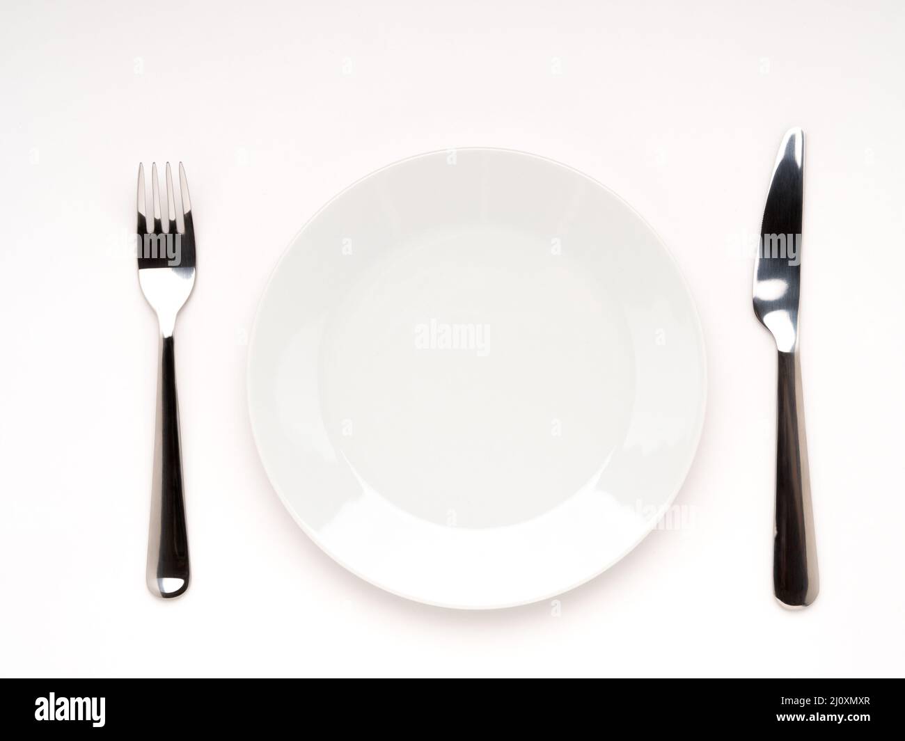 Round silver plate hi-res stock photography and images - Alamy