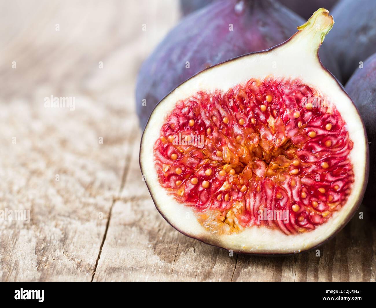 Fresh Fig and cut off half Stock Photo - Alamy