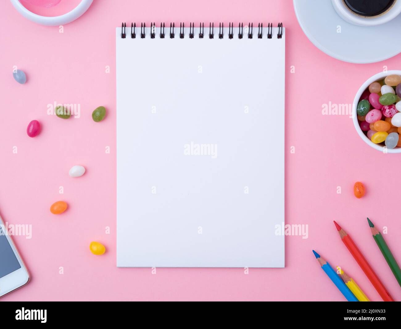 Open notebook with a clean white sheet, caramel, lollipops Stock Photo ...