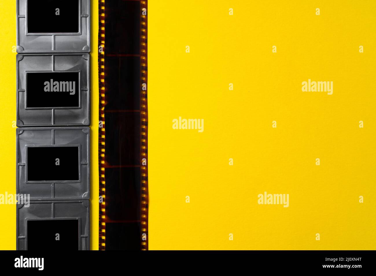 Photography empty slide frames on yellow background Stock Photo - Alamy