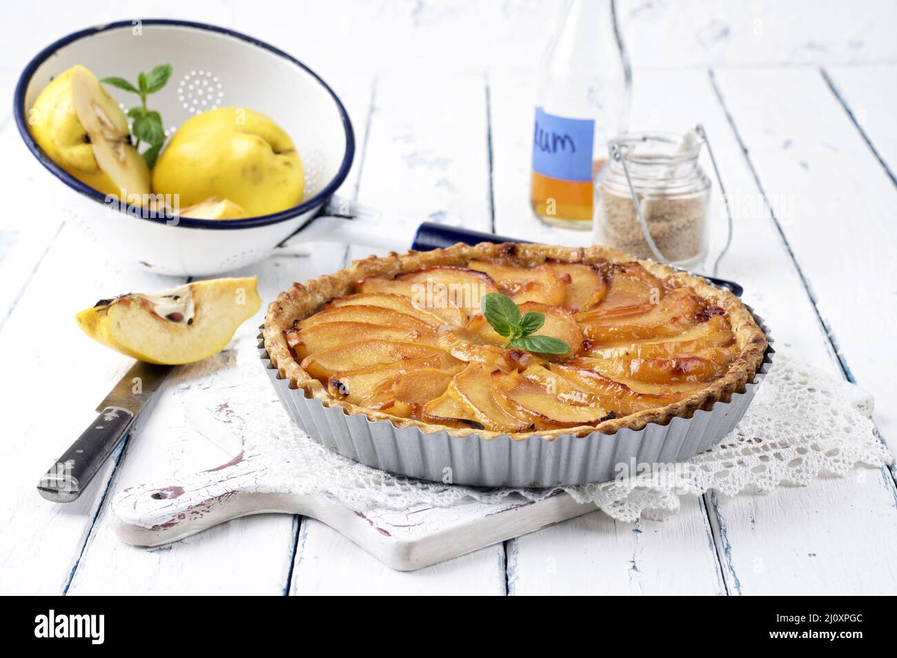 Traditional French quince tart aux pommes served as close-up in classic ...