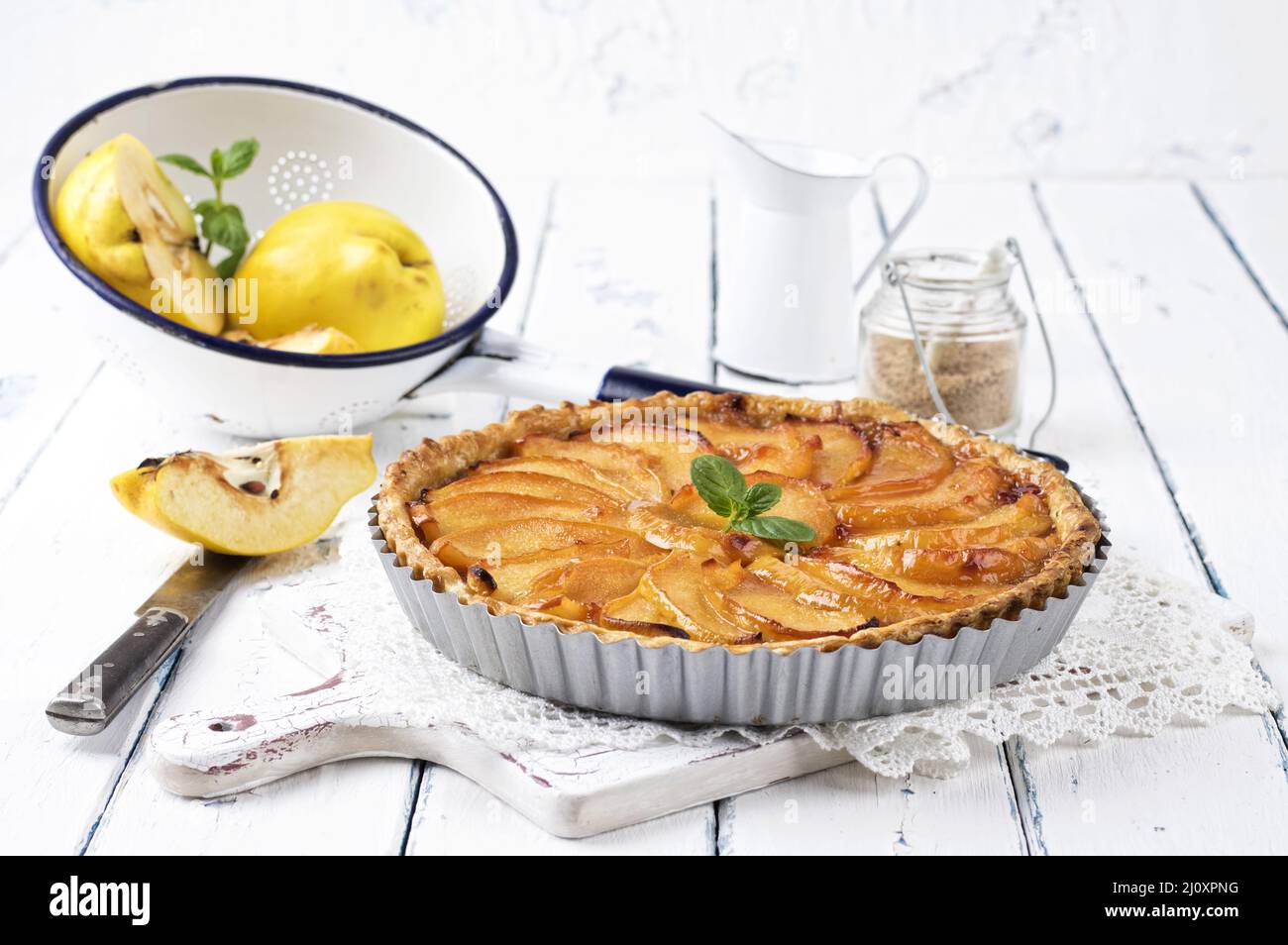 Traditional French quince tart aux pommes served as close-up in classic ...