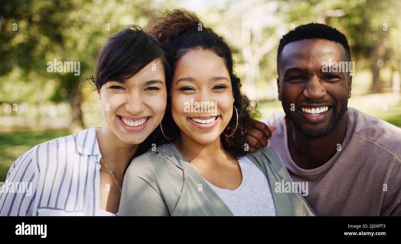 Smiles all around on a beautiful day. Portrait of a group of friends ...