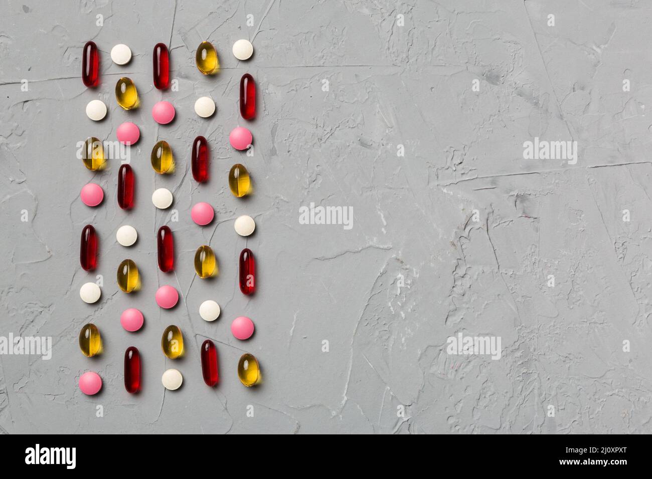 Many different pills and space for text on colorful background, top ...