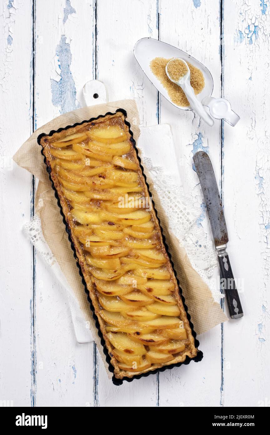 Traditional French quince tart served as top view in classic backing ...