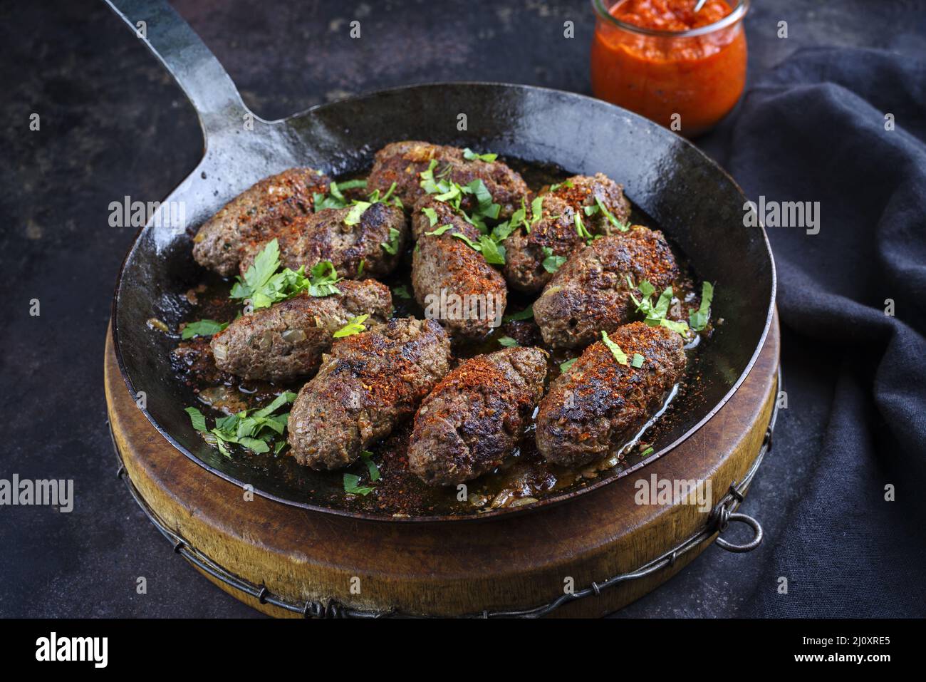 Traditional Croatian cevapcici spicy meat ball rolls with parsley and ...