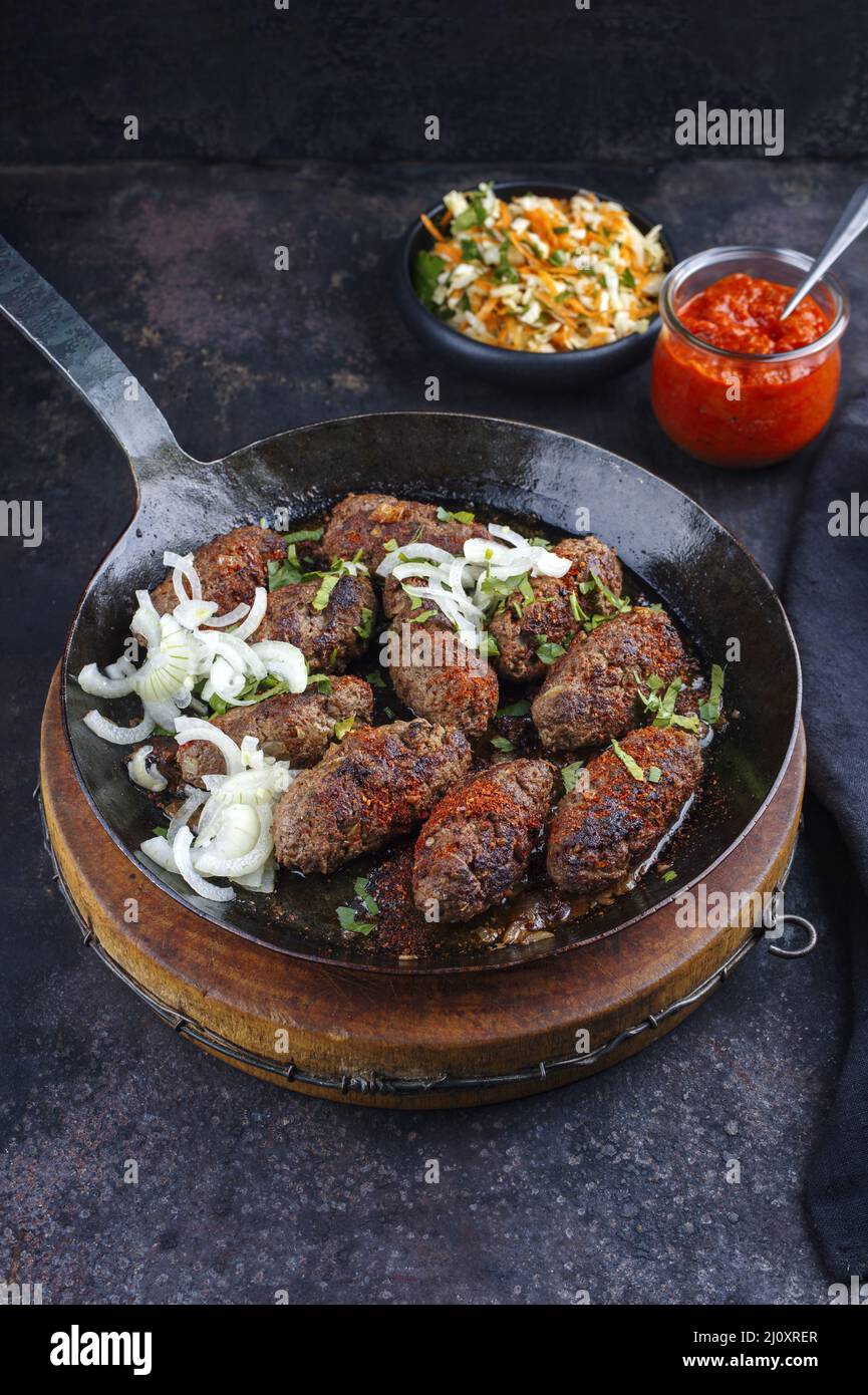 Traditional Croatian cevapi spicy meat ball rolls with cabbage carrot ...