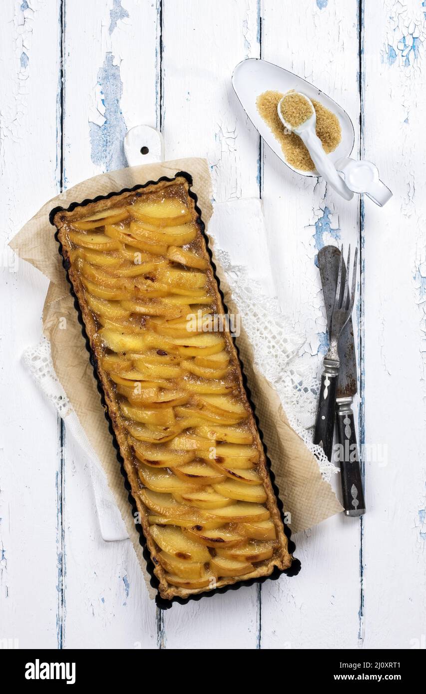 Traditional French quince tart served as top view in classic backing ...