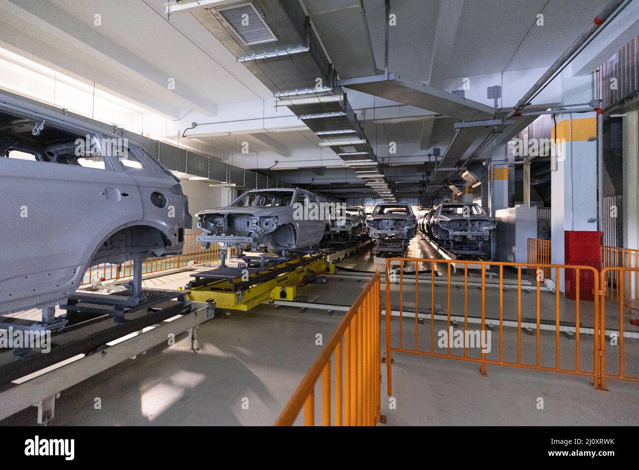 Car bodies are on assembly line. Modern automotive industry. A car ...