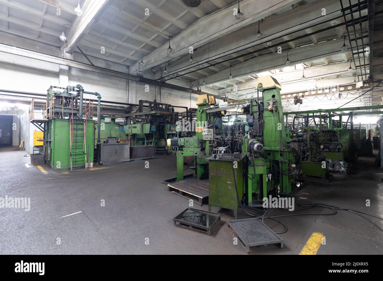 The interior of a big industrial building of factory with steel ...