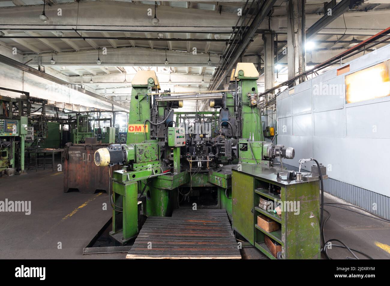 The interior of a big industrial building of factory with steel ...