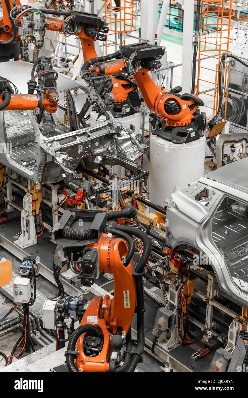 Vertical photo of automobile production line. Modern car assembly plant ...