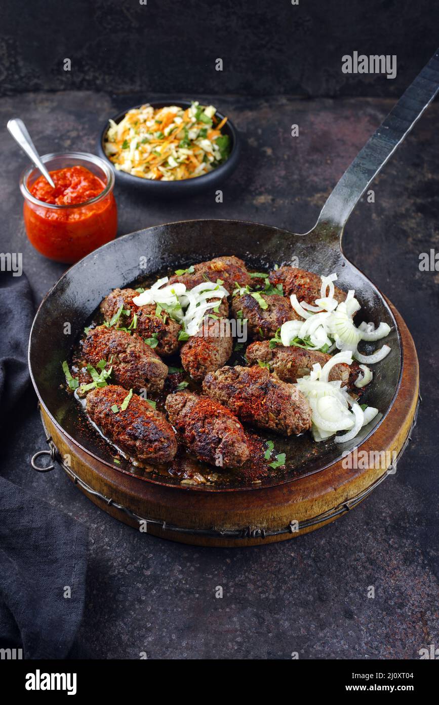 Traditional Croatian cevapi spicy meat ball rolls with cabbage carrot ...